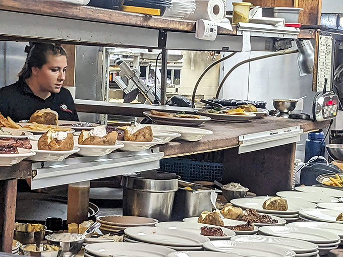 The kitchen pass—where dreams are plated and sent forth to create memories. Each dish a story, each plate a canvas.