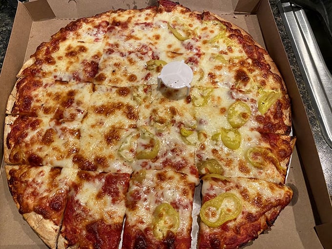 Half plain, half pepper pizza – the Switzerland of pies, maintaining peaceful relations between heat-seekers and traditionalists.