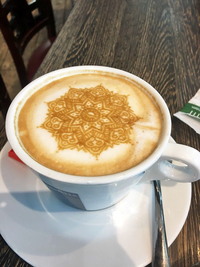 Latte art so intricate you almost feel guilty disturbing it—almost. This mandala of caffeine is meditation in a mug.
