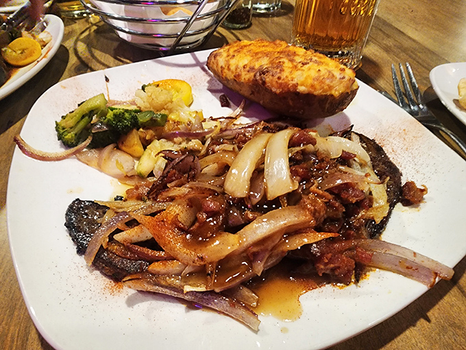 A plate that proves onions and liver were meant for each other&mdash;like an odd couple that somehow works perfectly. That baked potato is the reliable sidekick.