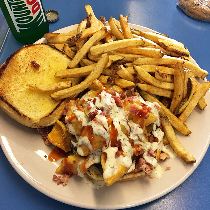 Cheese, pulled pork, and sauce performing a culinary ballet on Texas toast. The fries aren't just sides&mdash;they're supporting actors deserving their own award.