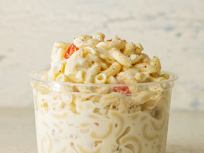 Creamy mac salad with pops of red pepper bringing the party. This side dish refuses to be overshadowed, demanding equal billing with its fried chicken costars.