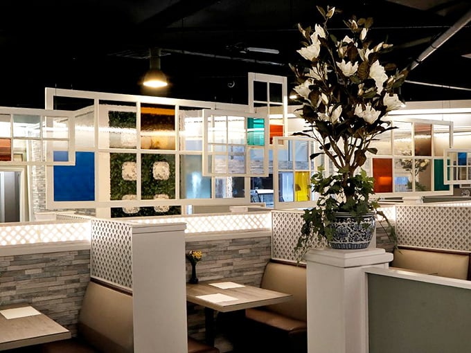 Modern meets traditional in the main dining room, where colorful dividers and blue-and-white pottery create an atmosphere of casual elegance.