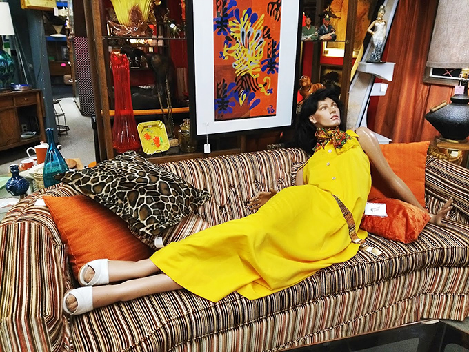 This mannequin isn't just modeling a dress&mdash;she's channeling 1970s glamour with an attitude that says "I've seen Studio 54." Yellow never looked so confident.