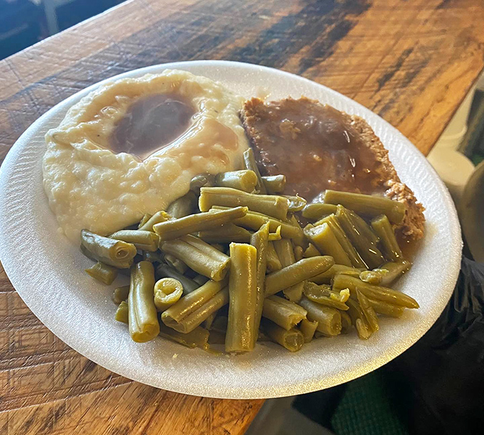 Country-style meatloaf, mashed potatoes with gravy lakes, and green beans cooked Southern-style&mdash;a plate that would make any grandmother nod in approval.