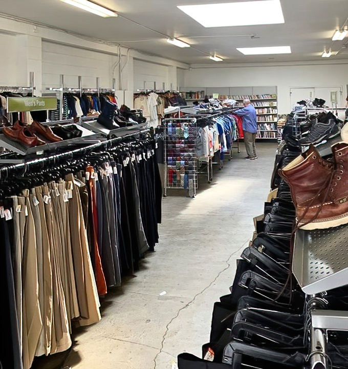 Men's fashion nirvana where vintage leather jackets hang alongside practical business wear, proving style doesn't have to come with sticker shock.