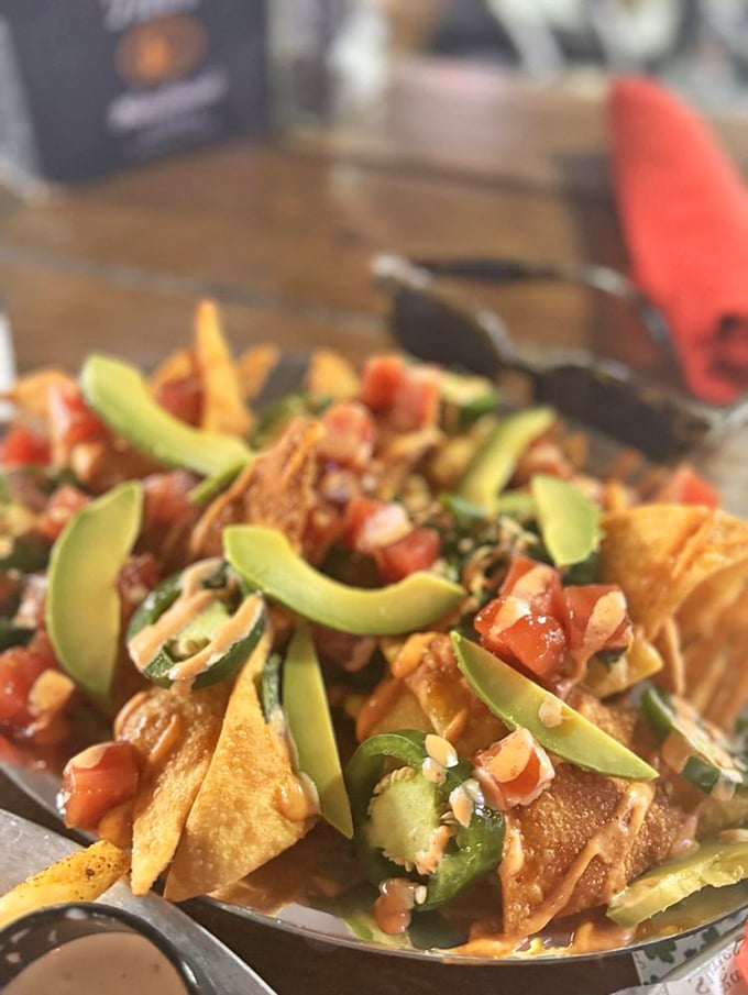 These aren't just nachos&mdash;they're an architectural marvel of crispy chips, fresh avocado, and enough toppings to require an engineering degree.