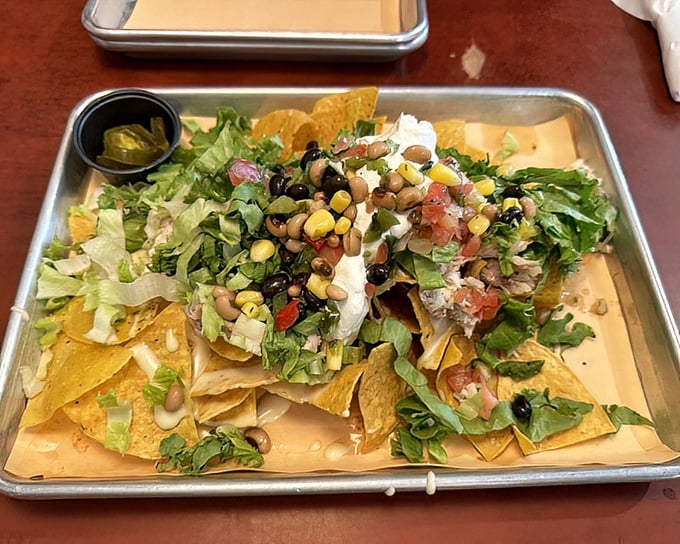 These aren't your ballpark nachos – fresh toppings, black beans, and corn create a colorful fiesta that's worth every crunchy bite.