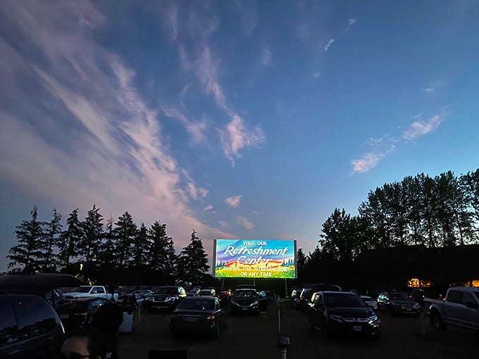 As twilight fades to darkness, the screen illuminates with pre-show advertisements&mdash;that magical moment when cars become personal theaters under Oregon skies. 