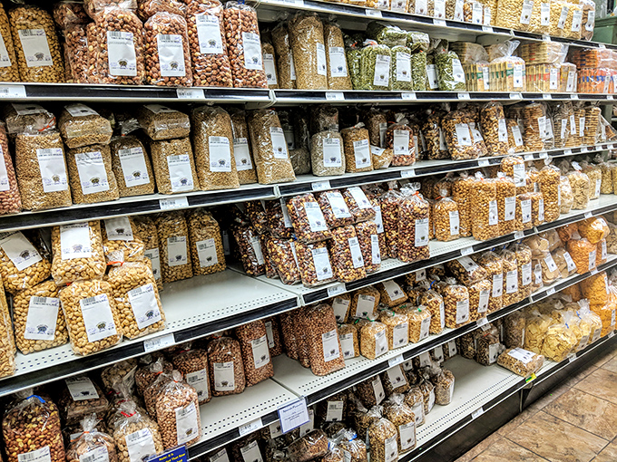 A wall of nuts and seeds that would make any squirrel reconsider its life choices and retirement plans.
