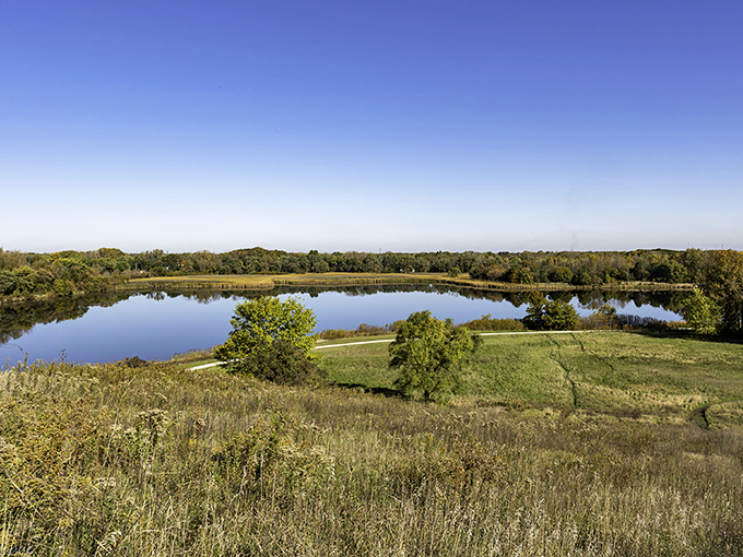 Peaceful lakes reflect mountain skies, creating postcard scenes that don't require expensive vacation packages.