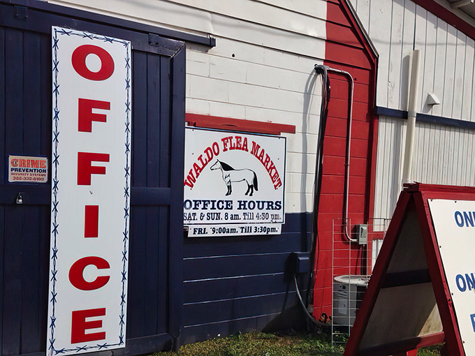 The office hours sign features the market's equine mascot &ndash; because nothing says "flea market" quite like a horse on a building.