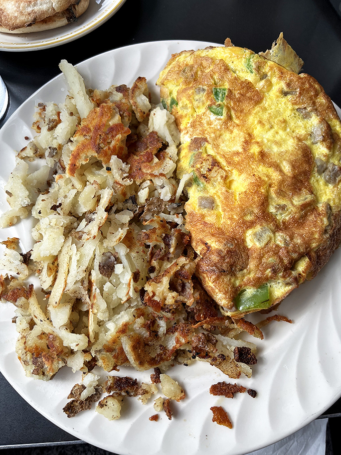 An omelet and hash browns that make you realize why breakfast deserves to be eaten at any hour of the day.