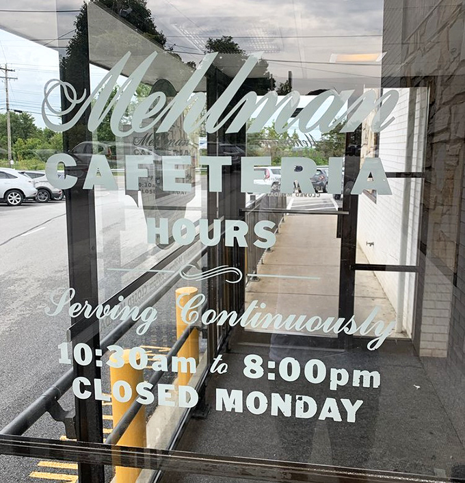 Hours posted on glass like a promise &ndash; "We'll be here when you need comfort food therapy."