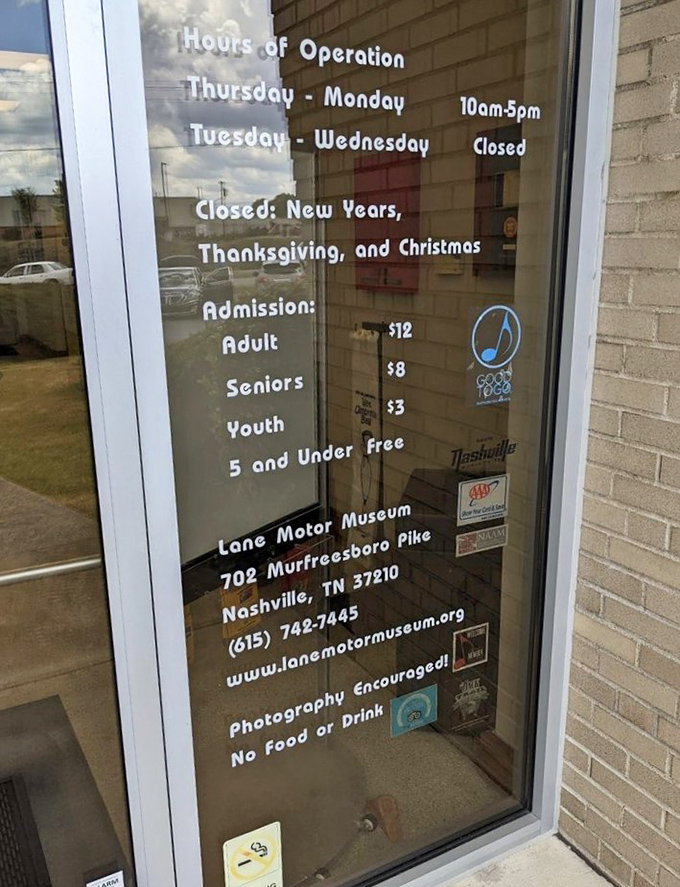 The museum's hours and admission information—proof that time-traveling through automotive history costs less than a tank of premium gas.