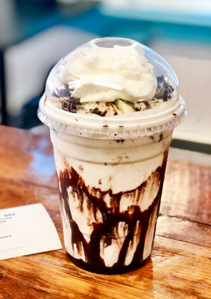 This isn't just a milkshake&mdash;it's dessert with drinking privileges. Chocolate swirls creating a work of drinkable art.