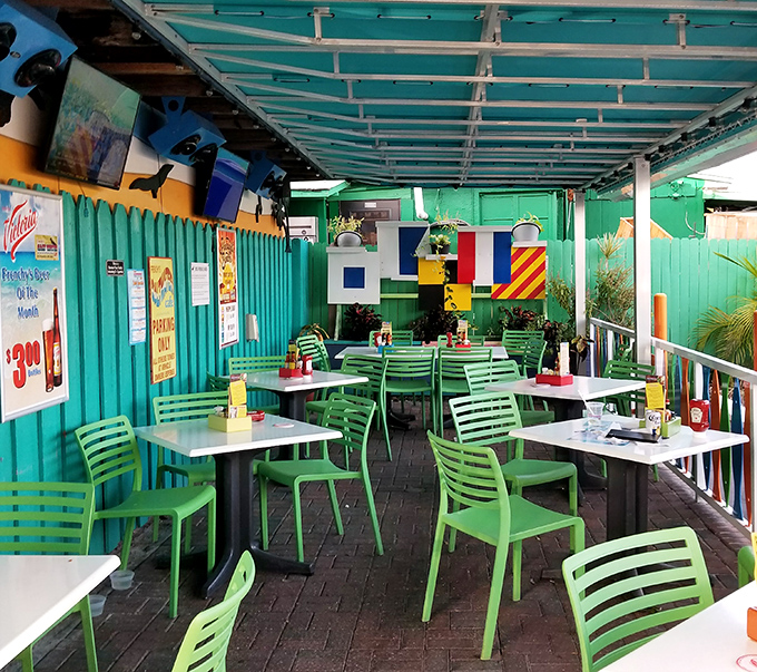 Outdoor dining with a side of vitamin sea. These mint-green chairs have witnessed countless seafood epiphanies and vacation memories.