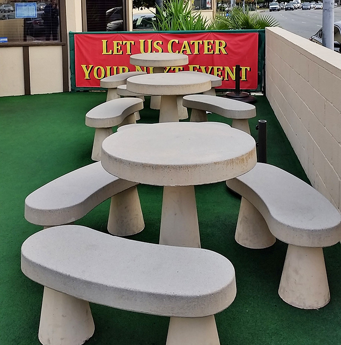 Outdoor seating for when your meat sweats demand fresh air. Those concrete tables have witnessed countless BBQ epiphanies.