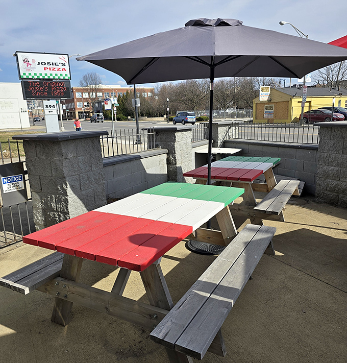 Picnic tables painted in Italian flag colors create the perfect outdoor pizza sanctuary when Ohio weather decides to cooperate.