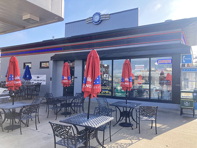 Outdoor patio dining extends the automotive theme into fresh air where classic cars meet comfort food.