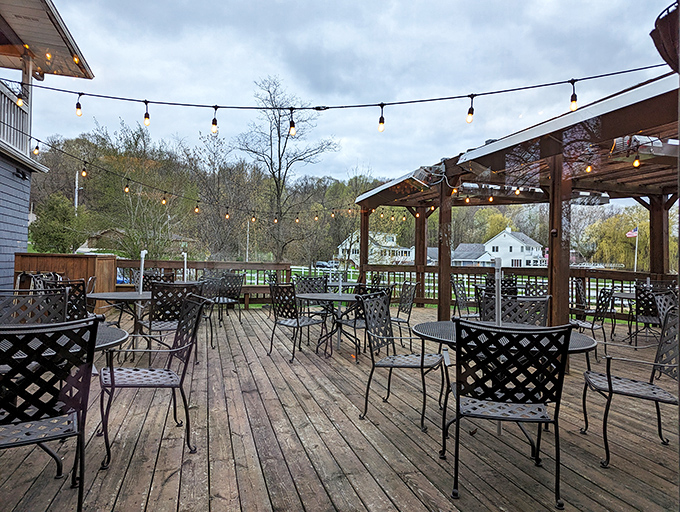 The outdoor deck, strung with lights and surrounded by trees, offers al fresco dining with a side of Wisconsin's natural beauty.