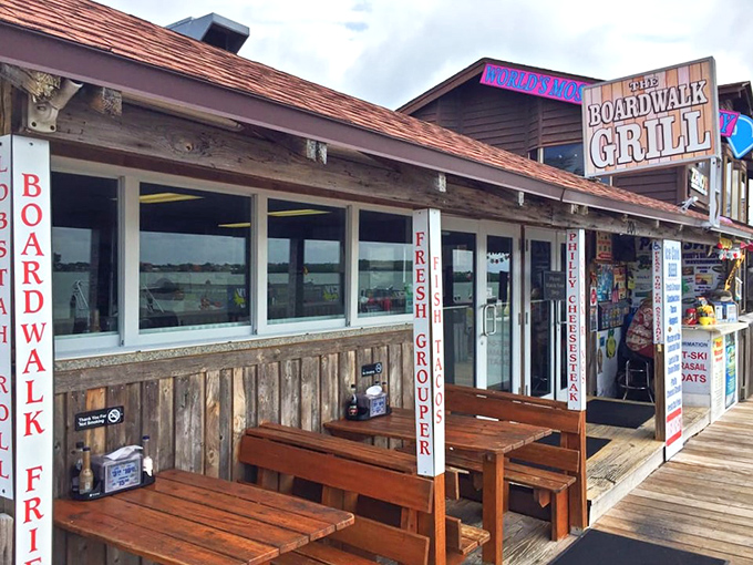 Rustic outdoor seating where sea breezes enhance every bite. These wooden benches have witnessed countless seafood epiphanies.