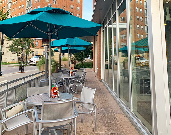 Patio seating for when your eggs Benedict needs a side of vitamin D. Those turquoise umbrellas pop against Madison's urban backdrop.