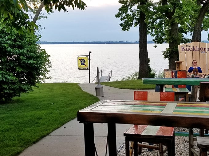 Lake Koshkonong stretches out beyond the lawn, a shimmering backdrop that changes with the seasons but always remains the perfect dining companion.