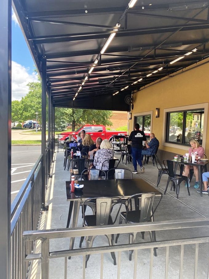 Outdoor seating where the morning air enhances the flavor of every bite&mdash;nature's own secret ingredient.