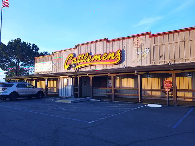 As dusk approaches, the Cattlemens sign glows like a beacon for hungry travelers, promising refuge from chain restaurants and salvation for empty stomachs.