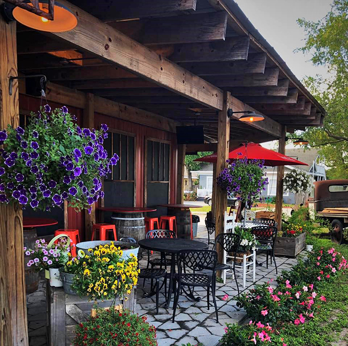 Outdoor seating made magical by purple petunias that seem to be competing with your sandwich for "most colorful thing on the table."