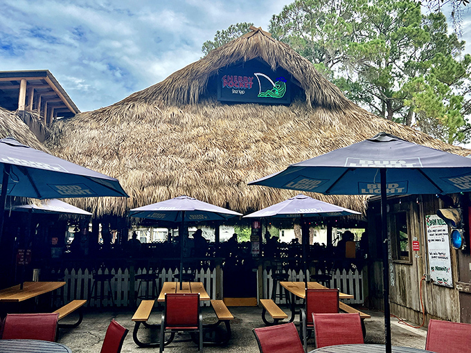 The thatched roof exterior could double as a movie set for "Florida Restaurant That Changed Someone's Life." Umbrellas optional, good times guaranteed.
