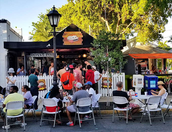 Sidewalk dining at DJ's: where people-watching and lobster-eating create the perfect Key West afternoon double feature.