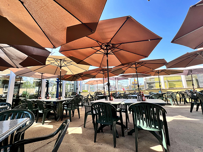 Outdoor seating under beach umbrellas&mdash;because sometimes pancakes taste even better with a side of sunshine.