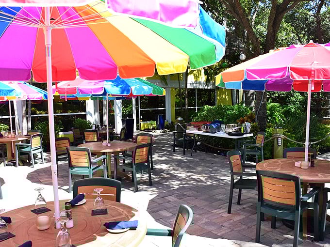 Outdoor dining under rainbow umbrellas creates the perfect Florida moment&mdash;casual, colorful, and with just enough shade to keep your key lime pie from melting too quickly.
