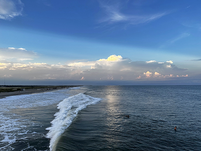 Ocean meets sky in a seamless blue canvas, interrupted only by perfect white-capped waves. Nature showing off again.