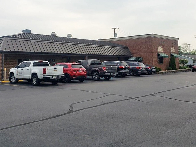 A parking lot filled with vehicles of people who understand that some journeys are worth making for a taste of something special.