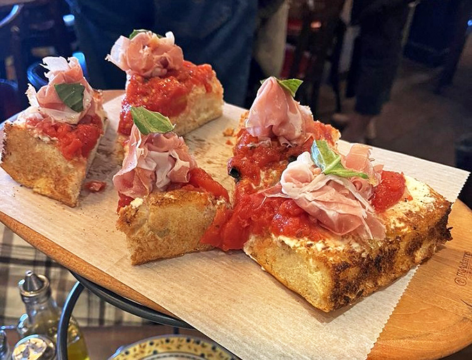 Bruschetta that makes you question why you ever settled for lesser versions. That prosciutto is practically posing for its glamour shot.
