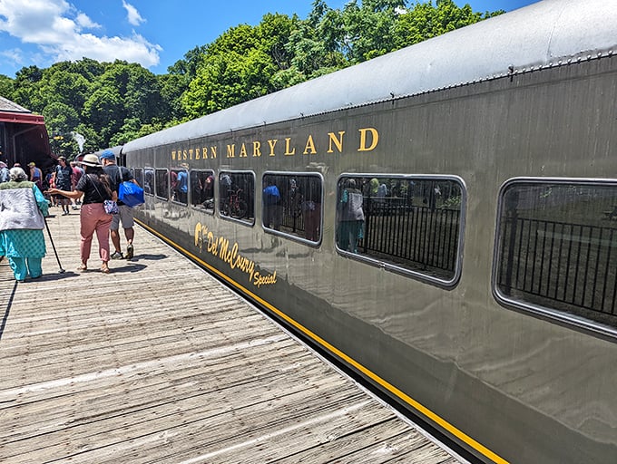 "All aboard the Mountain Explorer!" Passengers eagerly climb into their silver chariot, ready for adventures that can't be downloaded or streamed.