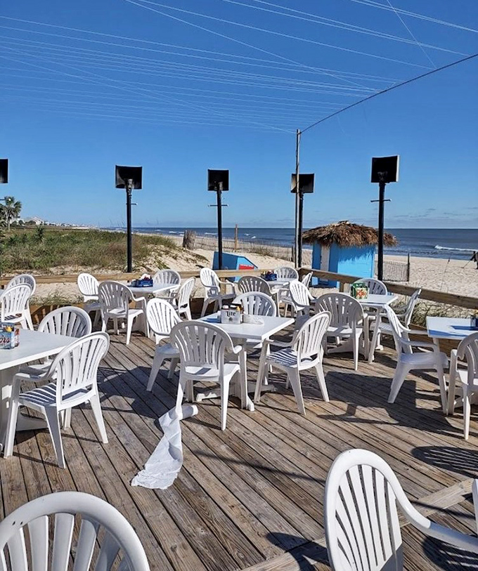 Social distancing, Florida style. This sun-drenched deck offers plenty of space to enjoy both solitude and seafood in equal measure.
