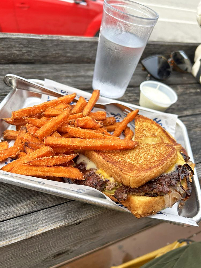 This isn't just a sandwich&mdash;it's a testament to the power of grilled bread and melted cheese. Those sweet potato fries are the bonus track on your favorite album. 