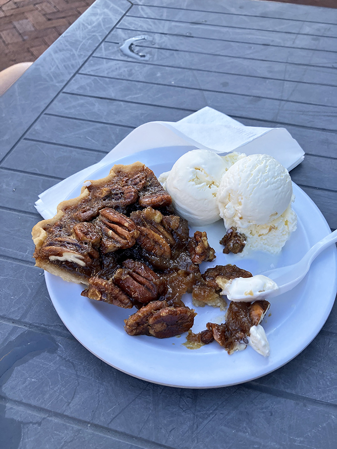 Pecan pie with ice cream melting alongside &ndash; the South's answer to world peace, one nutty, gooey, creamy bite at a time.
