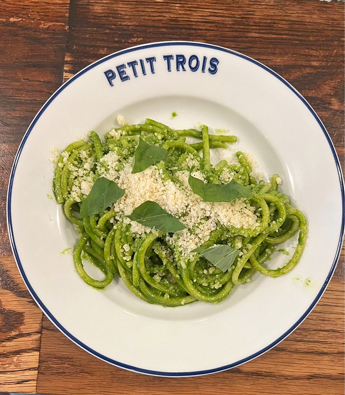 This vibrant green pasta isn't just a dish&mdash;it's edible optimism. Perfectly cooked strands coated in herb-forward pesto and dusted with cheese invite twirling and contemplation.