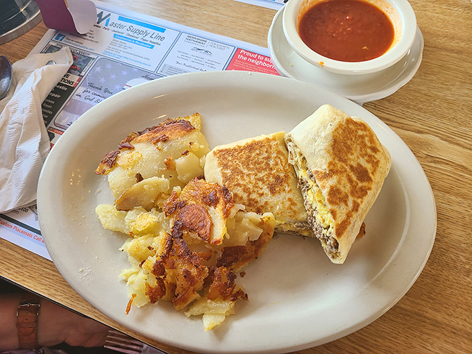This sandwich and soup combo isn't just lunch – it's edible therapy after a long morning, with crispy potatoes as the perfect sidekick.