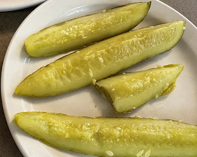 These aren't just any pickles &ndash; they're the perfect acidic counterpoint to the rich sandwiches. The unsung heroes of the deli experience.