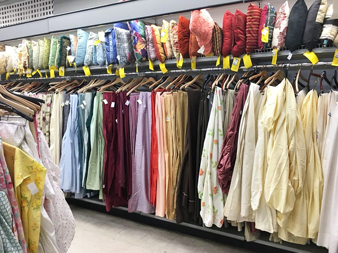 Decorative pillows and curtains line up like soldiers ready for home decor duty. Martha Stewart would approve of these budget-friendly room refreshers.