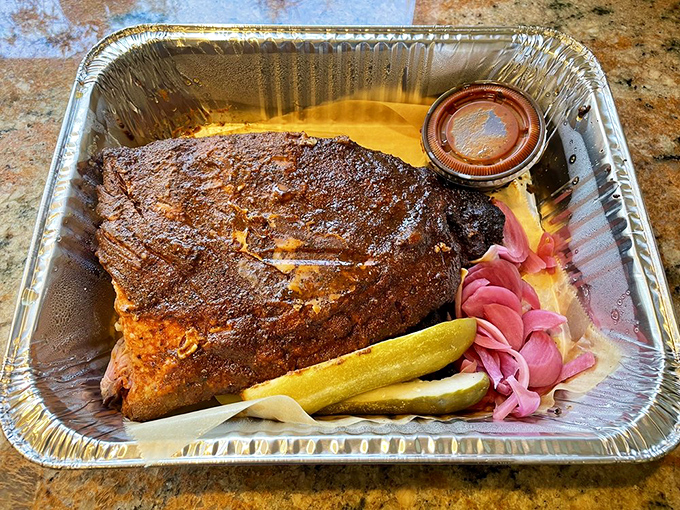 Behold: meat candy in its natural habitat. Those pink pickled onions aren't just garnish&mdash;they're essential supporting characters in this smoky drama.