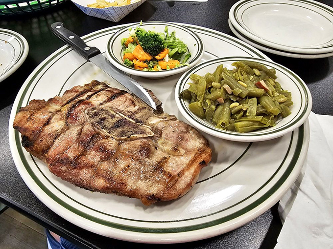 A pork chop with perfect grill marks flanked by green beans and a salad &ndash; proof that Tom & Ray's isn't just about breakfast.