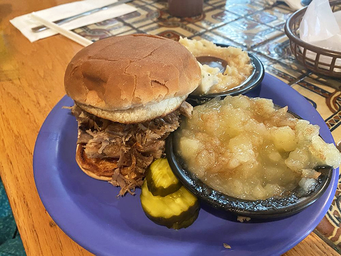 A pulled pork sandwich that doesn't need Instagram filters, accompanied by applesauce and mashed potatoes &ndash; comfort food's greatest hits album. 