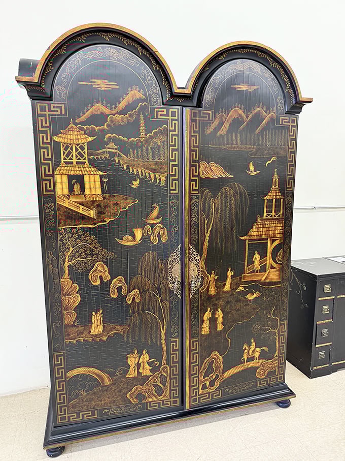 This isn't just furniture&mdash;it's functional art. The intricate Asian-inspired cabinet would make even the most minimalist decorator reconsider their life choices.